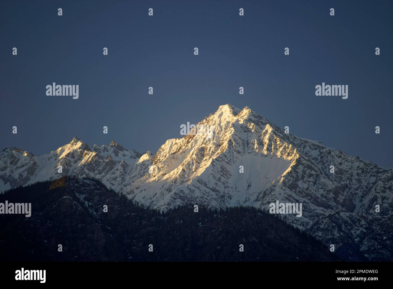 View of a Himalayas snow covered peaks from Sarahan of state Himachal ...
