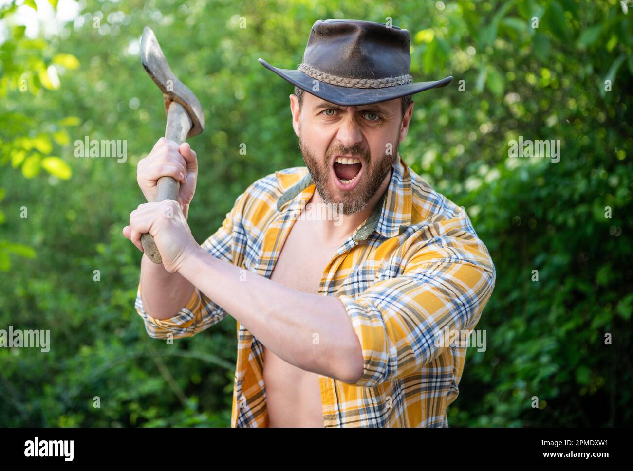 angry lumberjack shout with axe outdoor. photo of angry lumberjack with ...