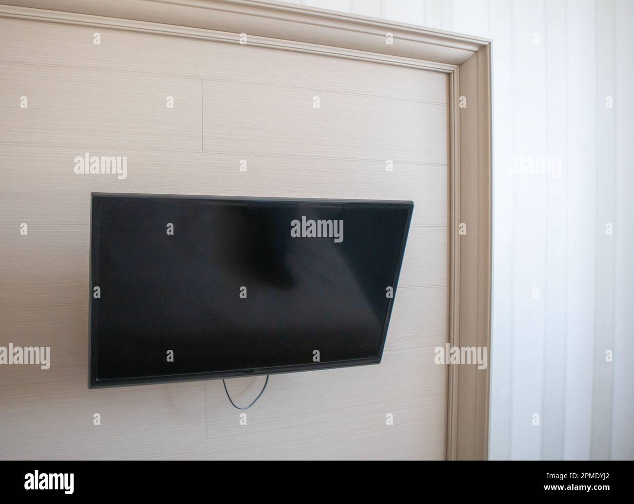 Modern design of a room with a black plasma LED TV on the wall, a mock ...