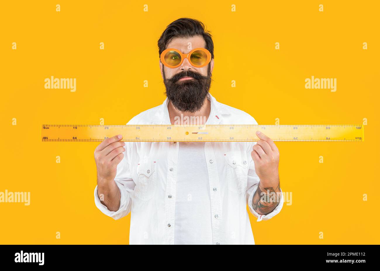 confused school man measure with ruler isolated on yellow. school man ...