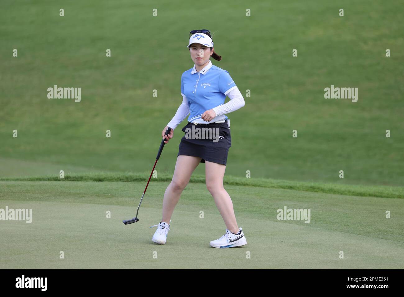 Yuna Nishimura, of Japan, in action on the 18th green during the first ...