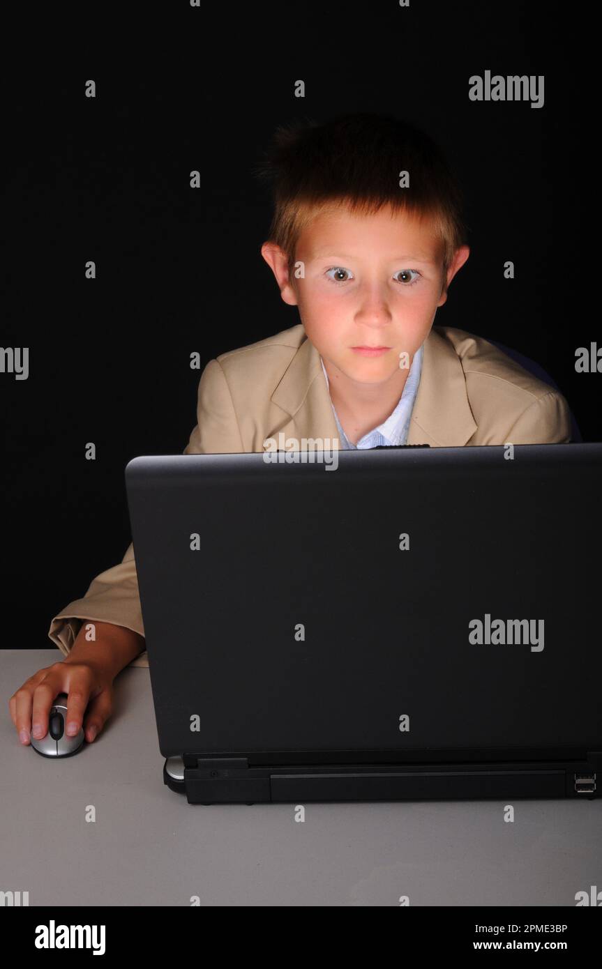A Young boy businessman hard at work Stock Photo - Alamy