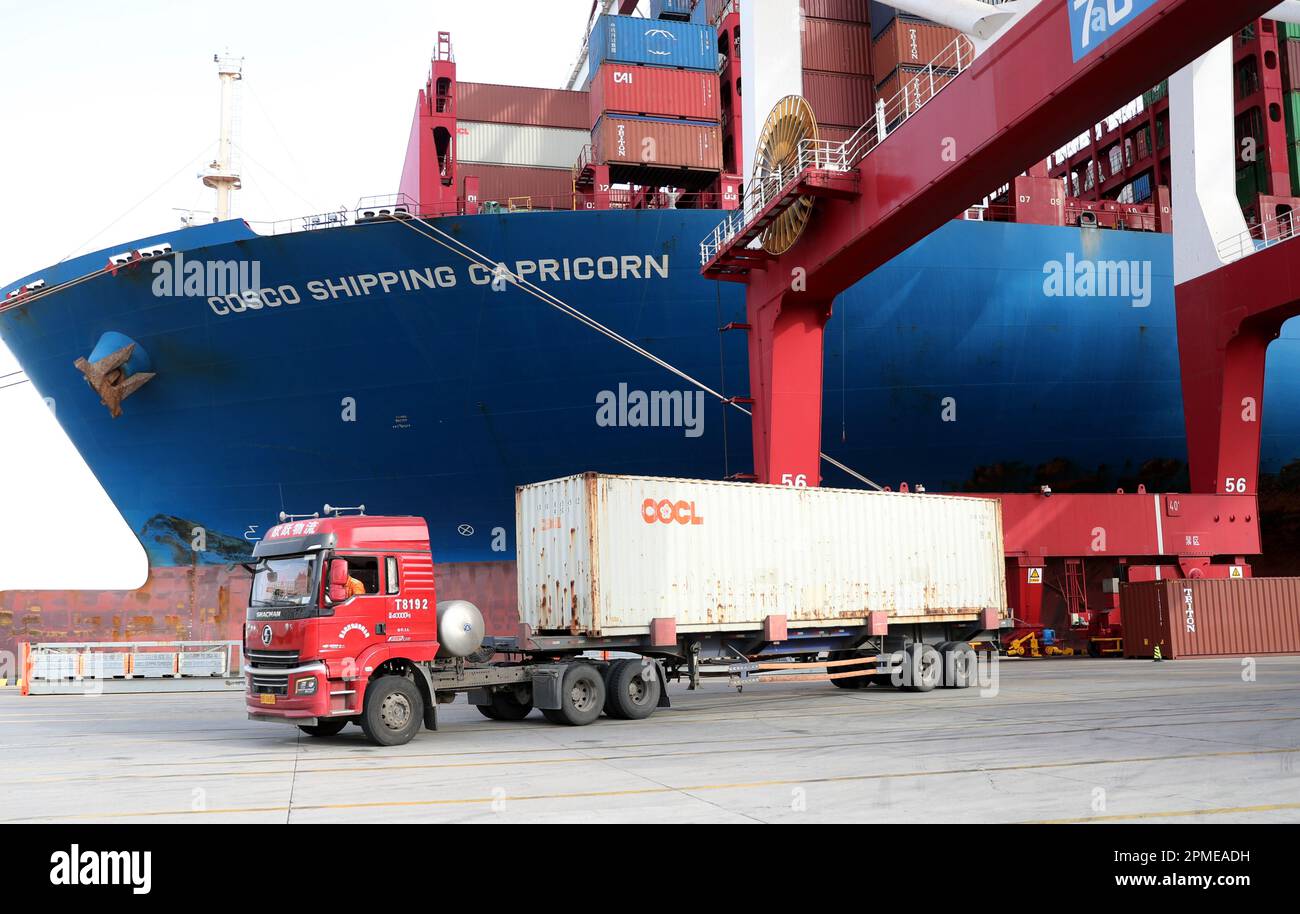 QINGDAO, CHINA - APRIL 13, 2023 - Container trucks deliver goods at the ...