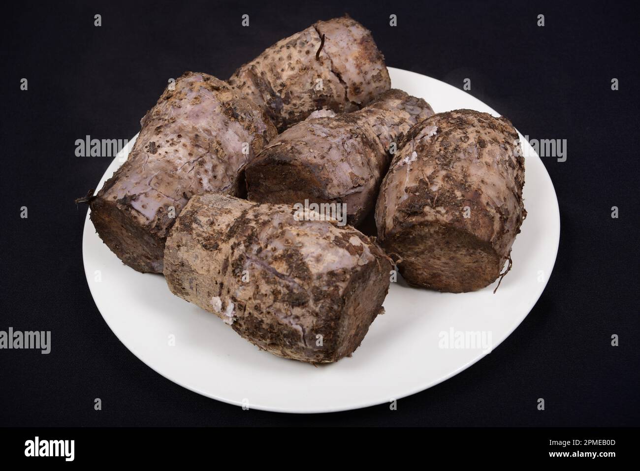 Boiled arrowroots "nduma" unpeeled on an isolated background Stock ...