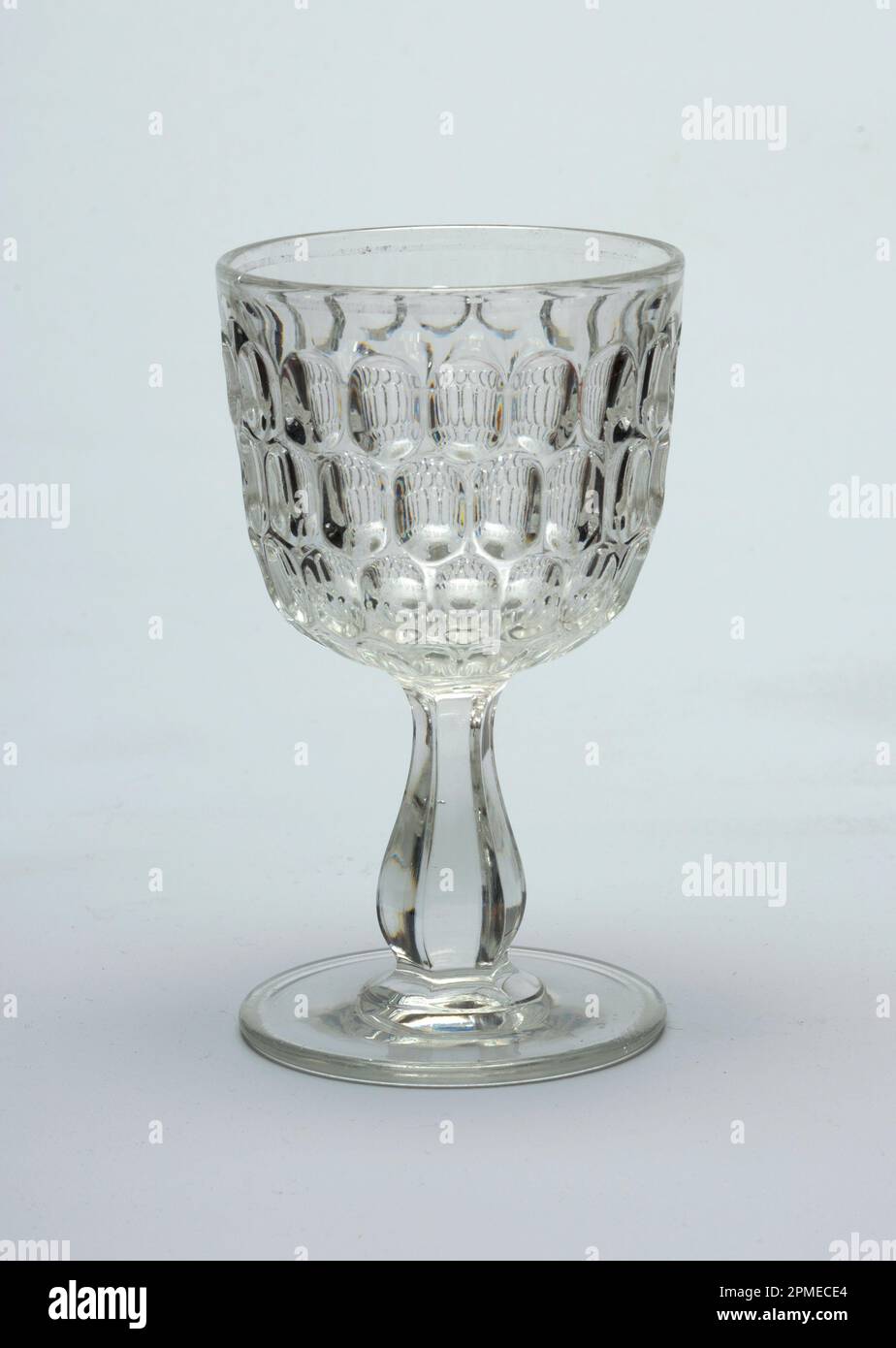 Thumbprint Goblet; USA; pressed glass; Overall: 16 x 9.4 cm diameter (6 ...