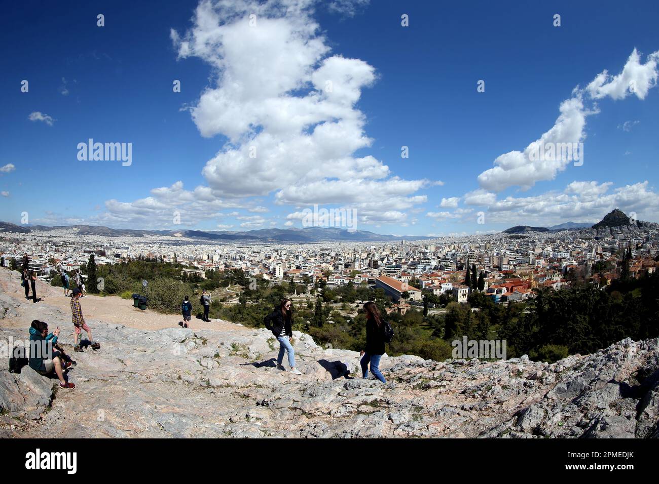 Crowd of tourists at the Areopagus, it is a rock outcropping located ...