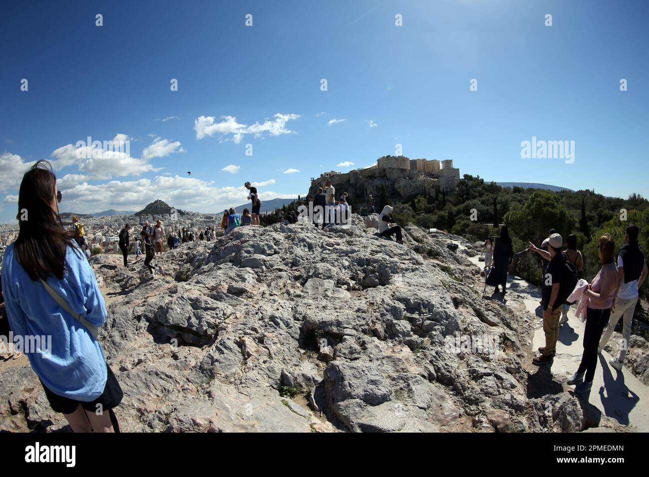 Crowd of tourists at the Areopagus, it is a rock outcropping located ...