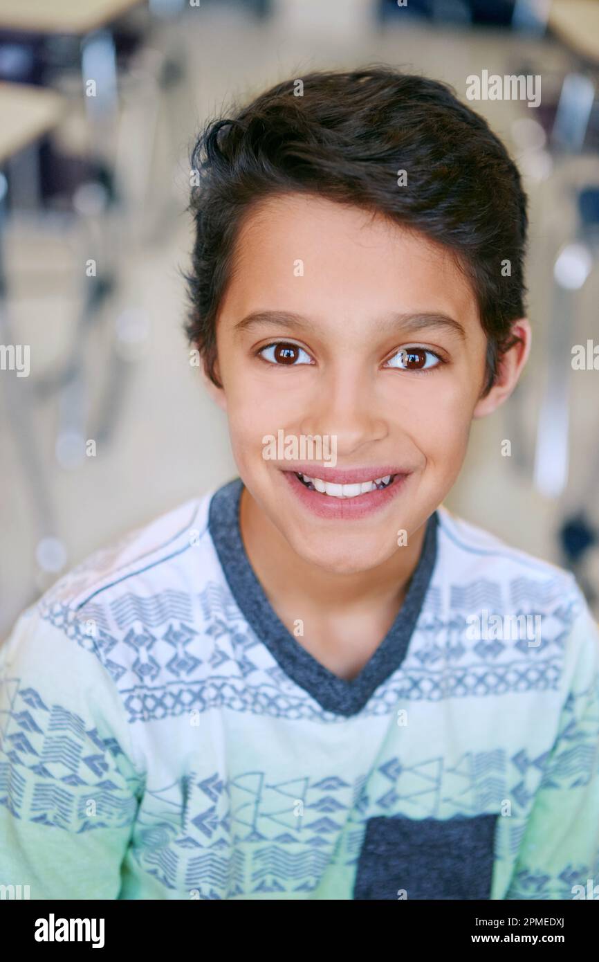 Growing up confidently. Portrait of a smiling elementary student at ...
