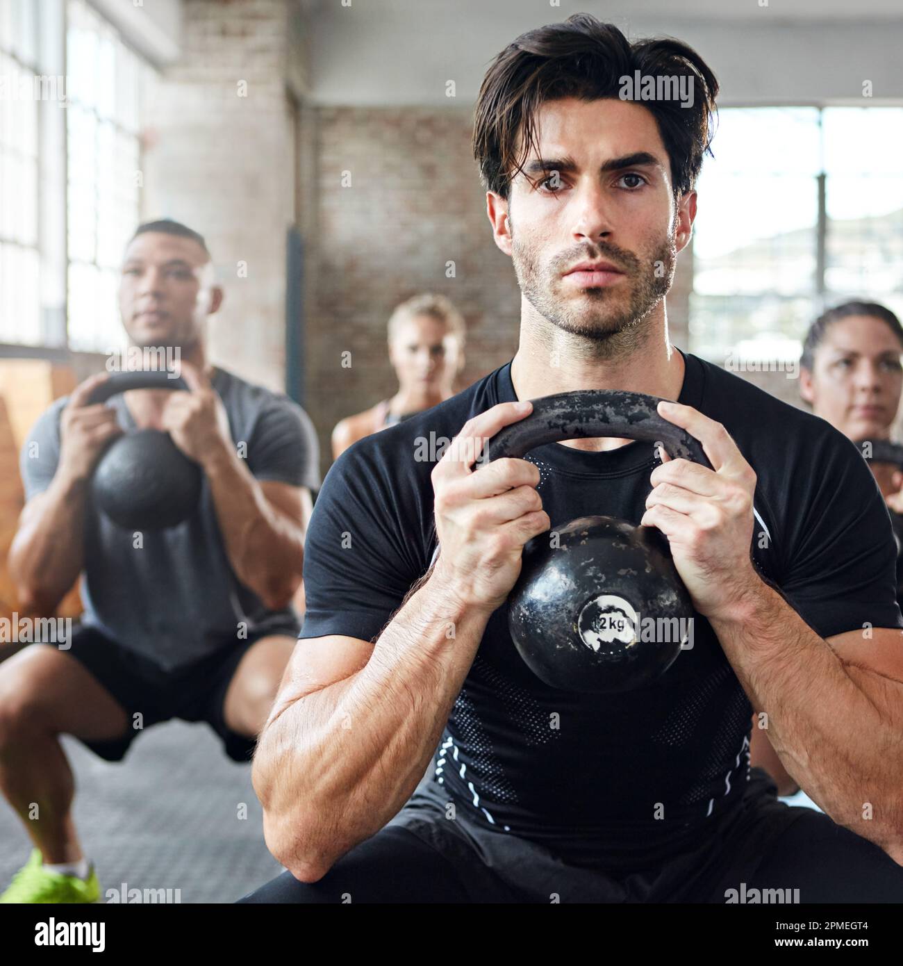 Diverse fit women doing squats hi-res stock photography and images - Alamy