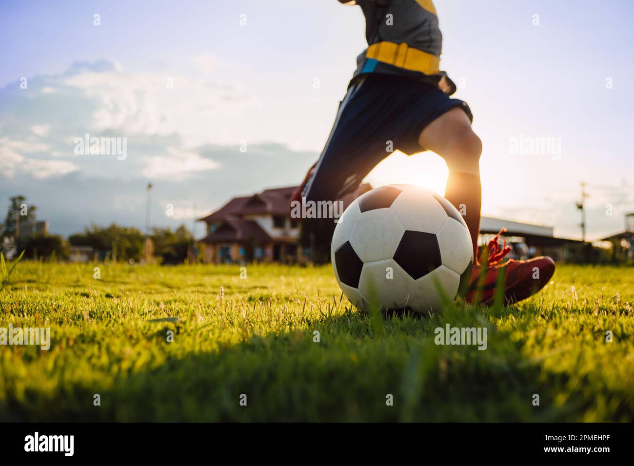 action sport outdoors of a group of kids having fun playing soccer ...
