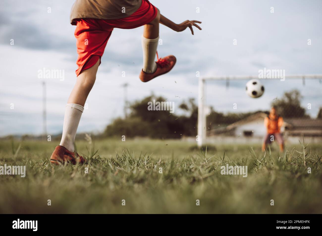 action sport outdoors of a group of kids having fun playing soccer ...