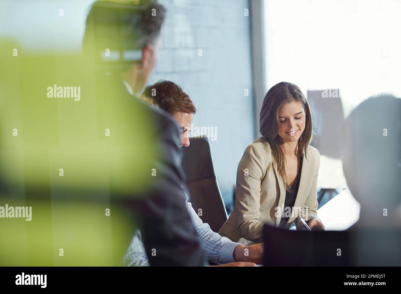 Staying updated with weekly management meetings. a team of colleagues ...