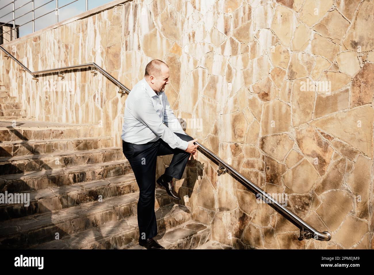 Portrait of a senior professional man in a suit with various problems ...