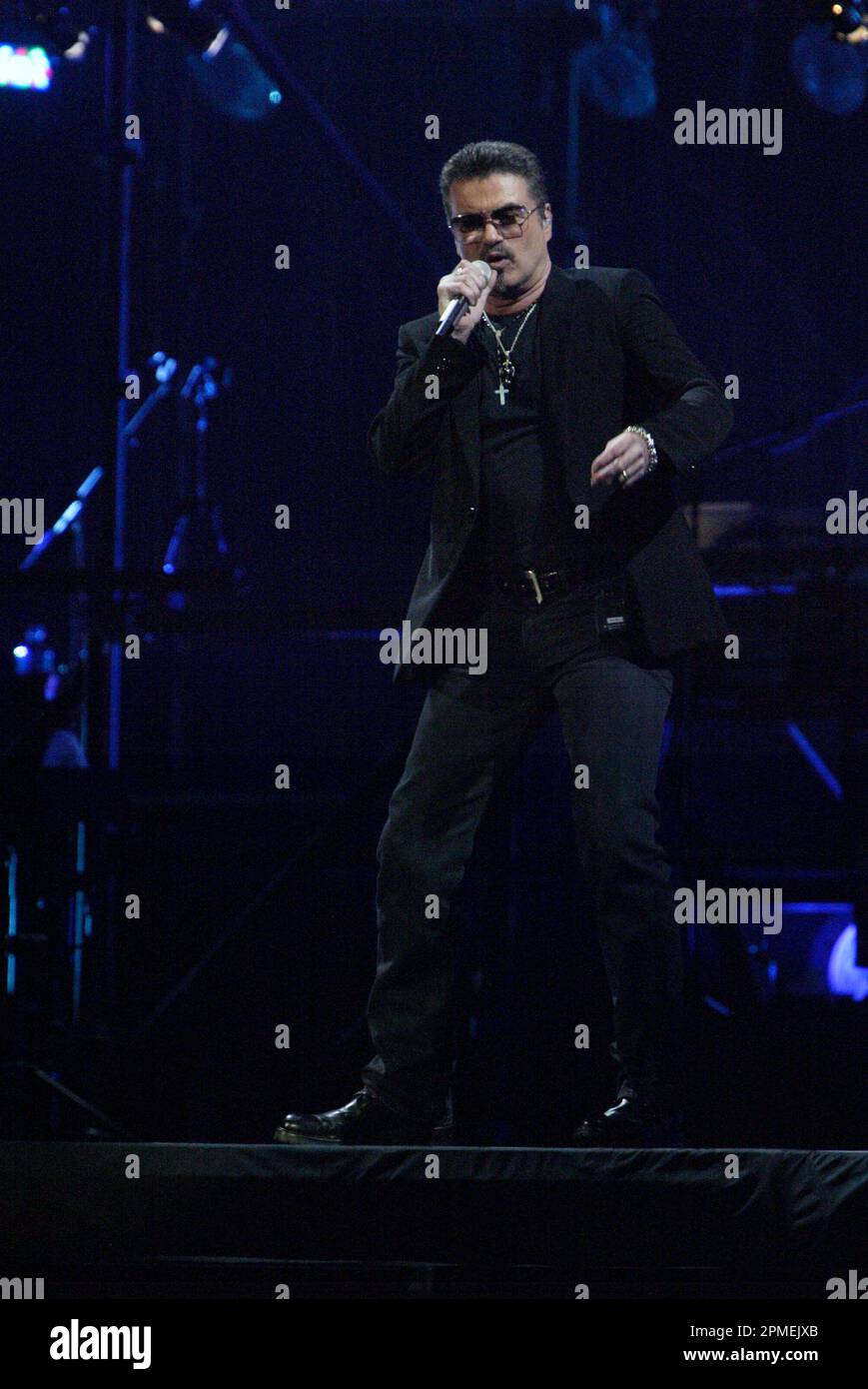 George Michael performing live in concert to a sell-out crowd of 45,000 ...