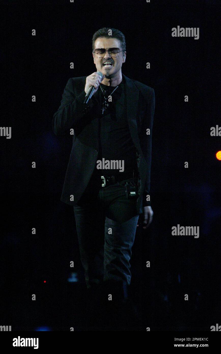 George Michael performing live in concert to a sell-out crowd of 45,000 ...