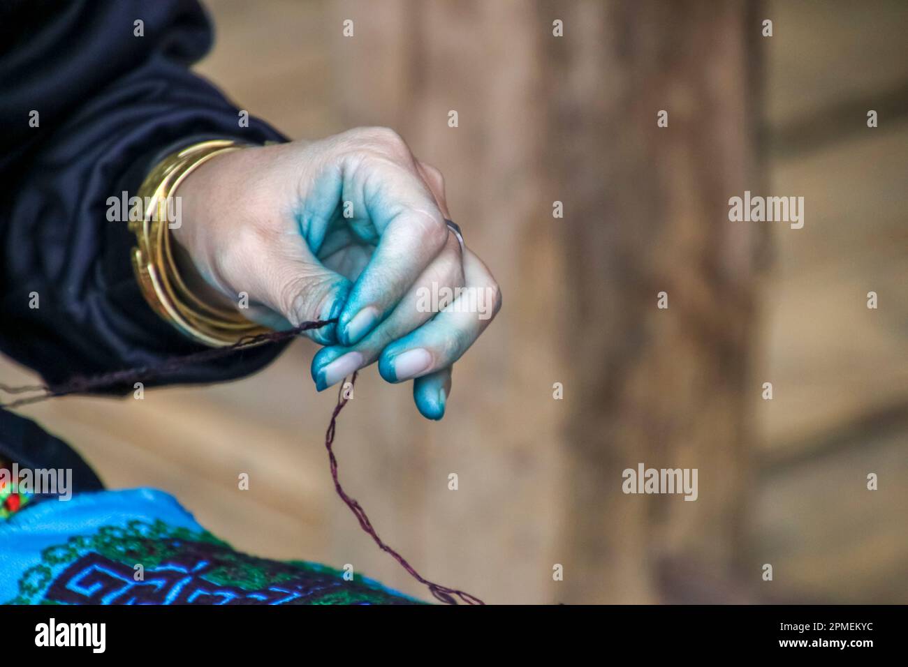 Traditional Vietnamese handcrafts Woman sawing photographed in Sa Pa ...