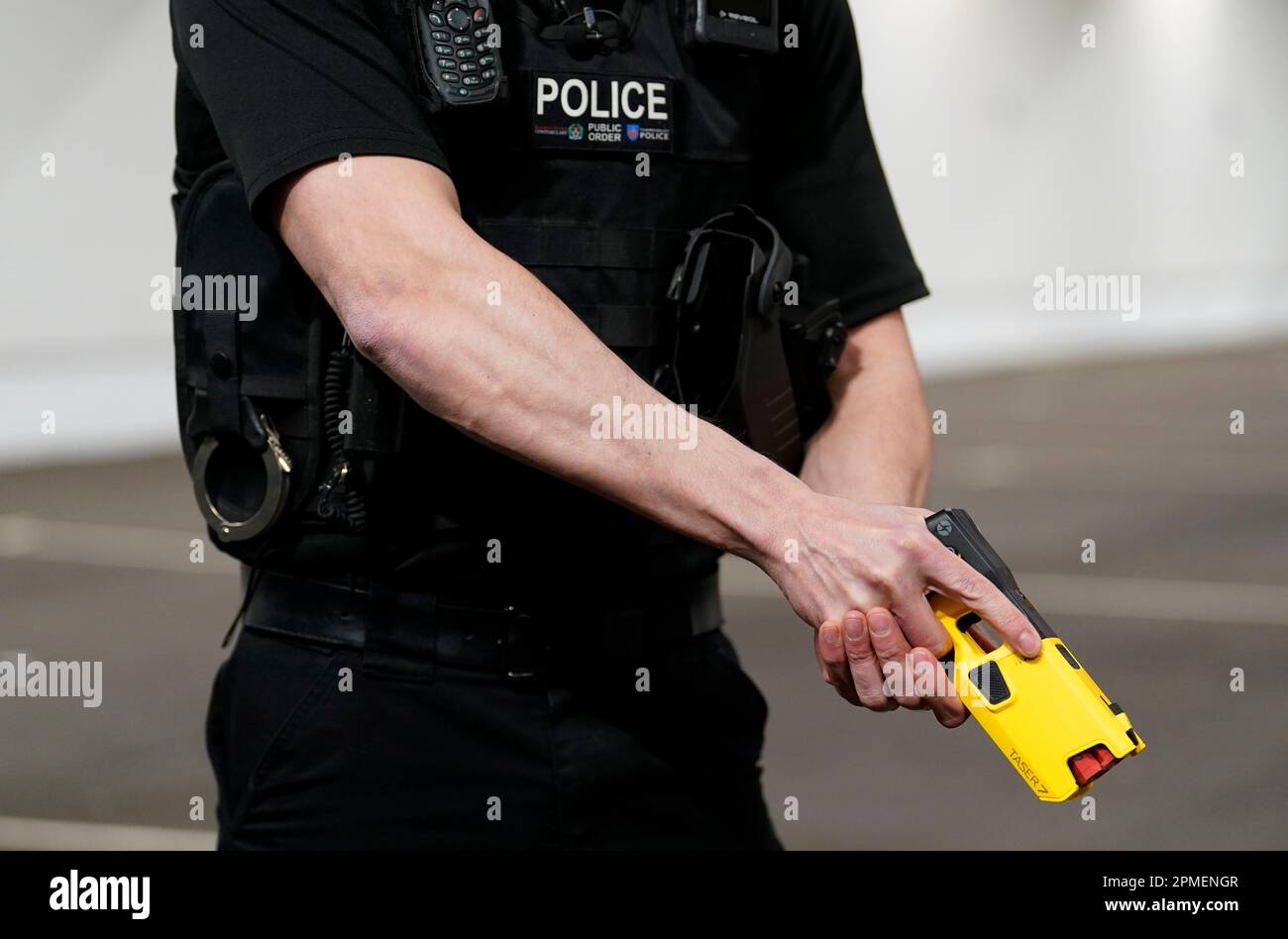 An officer holds the new Taser 7 during a demonstration as Hampshire ...