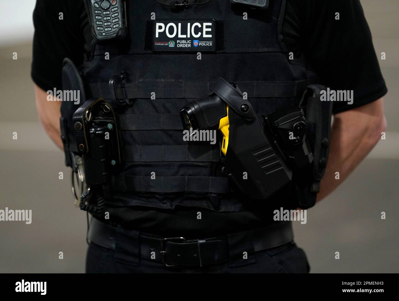 An officer wears the new Taser 7 in a holster during a demonstration as ...
