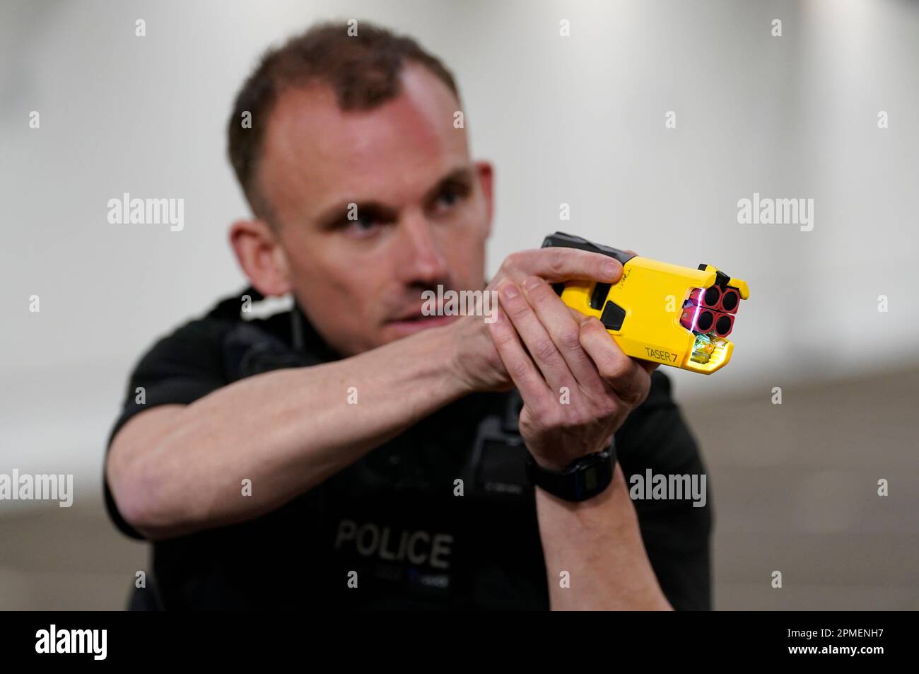 An officer holds the new Taser 7 during a demonstration as Hampshire ...