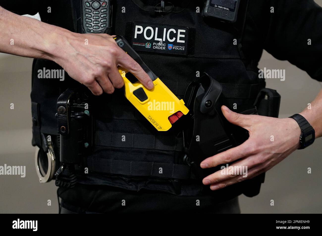 An officer holsters the new Taser 7 after a demonstarion as Hampshire ...