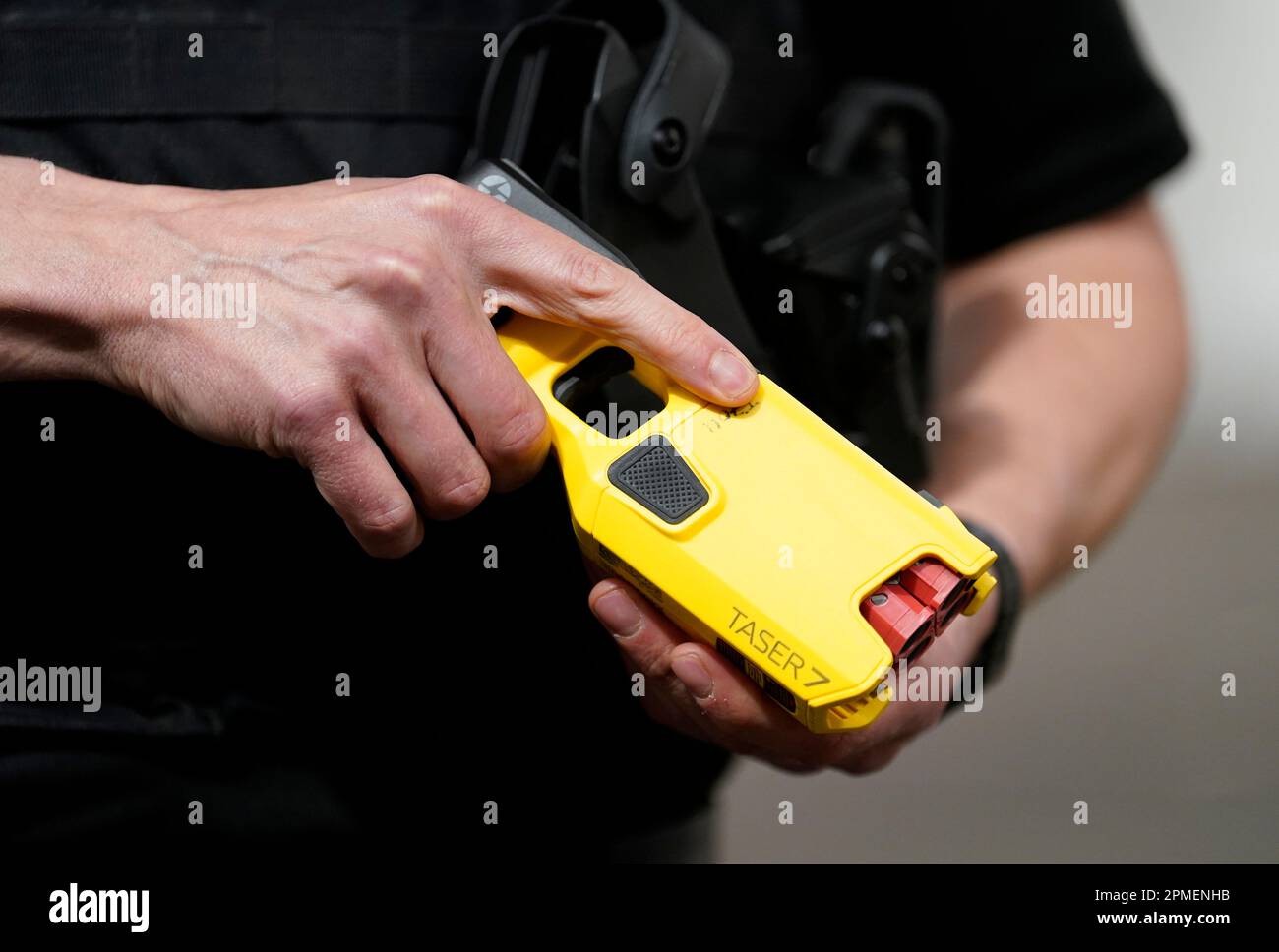 An officer holds the new Taser 7 during a demonstration as Hampshire ...