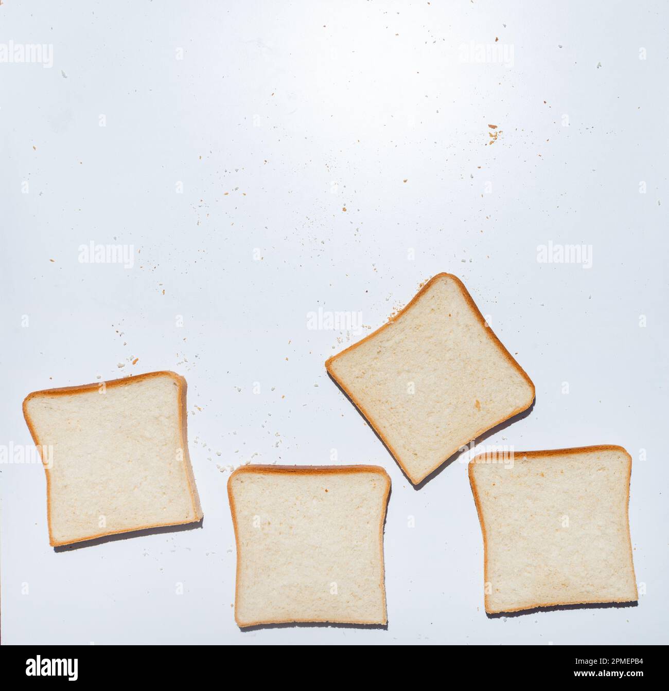 Top view of white toast bread slices with crumbs on isolated white ...