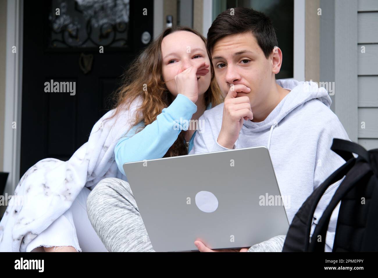 Tell me your secrets. Pleasant smiling asian woman whispering on ear to ...