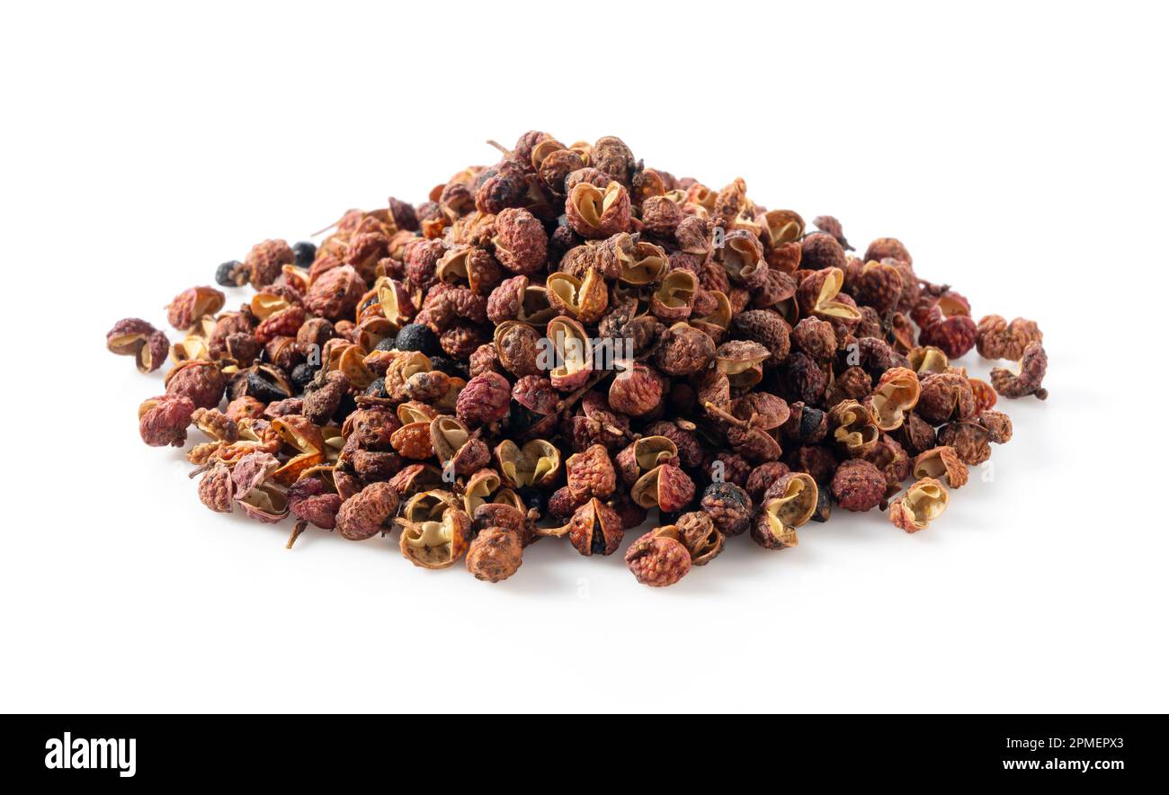 Sichuan pepper placed on a white background. Sichuan pepper is a member ...
