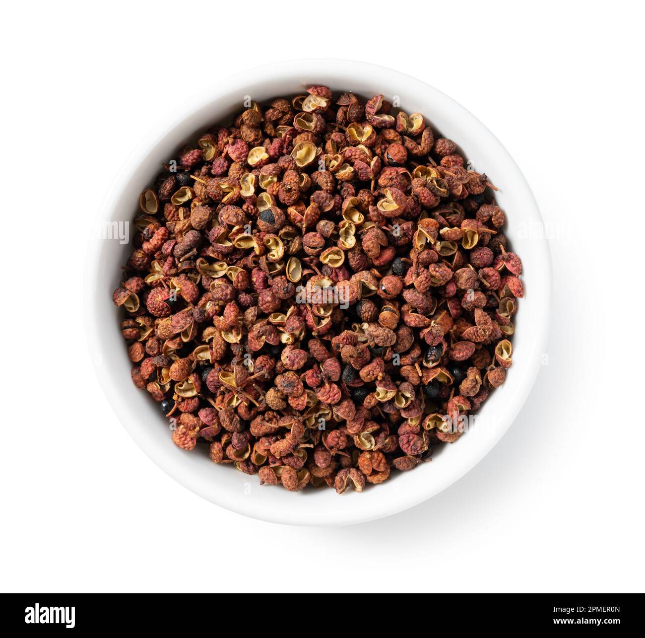 Sichuan pepper in a white bowl set against a white background. Sichuan ...