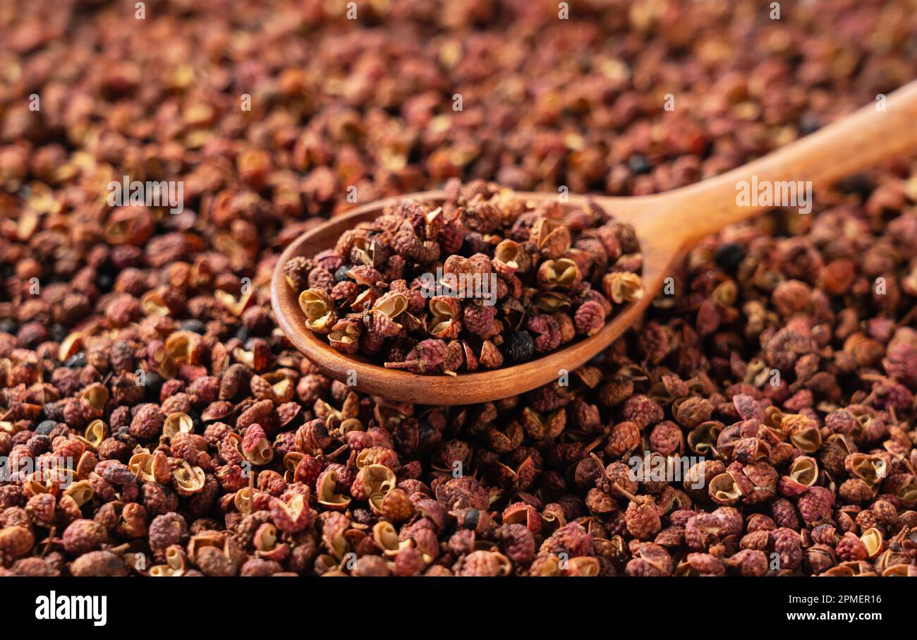 Sichuan pepper and wooden spoons placed throughout the screen. Sichuan ...