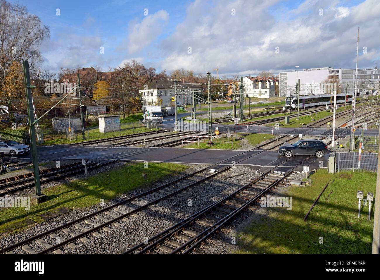 Two level crossings, each side of the Swiss-German border, with fences ...