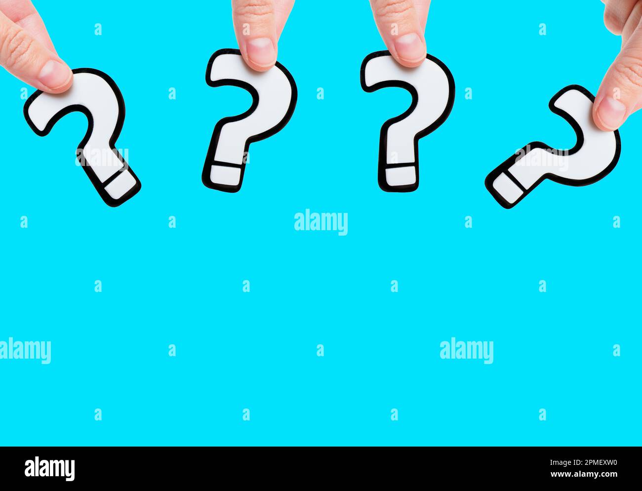Group of white question marks shapes in hands isolated on blue ...