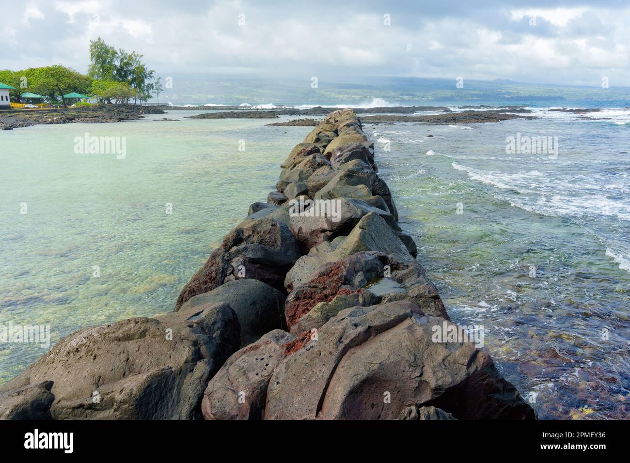 Barrier line of massive volcanic stones separating the coast of Hawaii ...