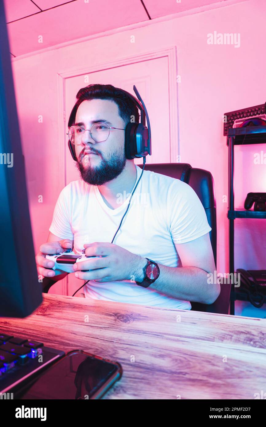 Professional video game player holding a joystick playing with a ...