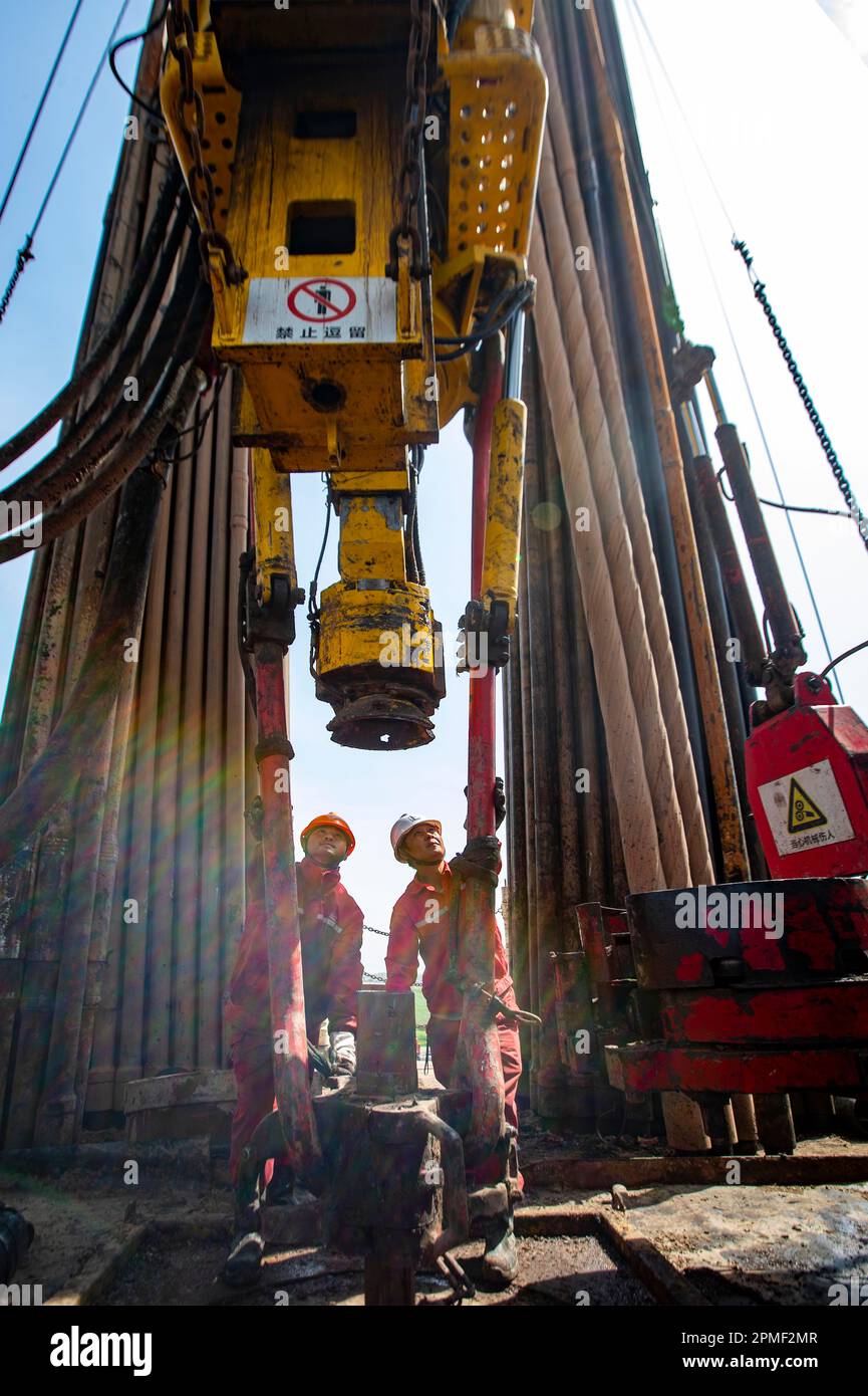 TAIZHOU, CHINA - APRIL 13, 2023 - Drillers work at a shale oil well ...