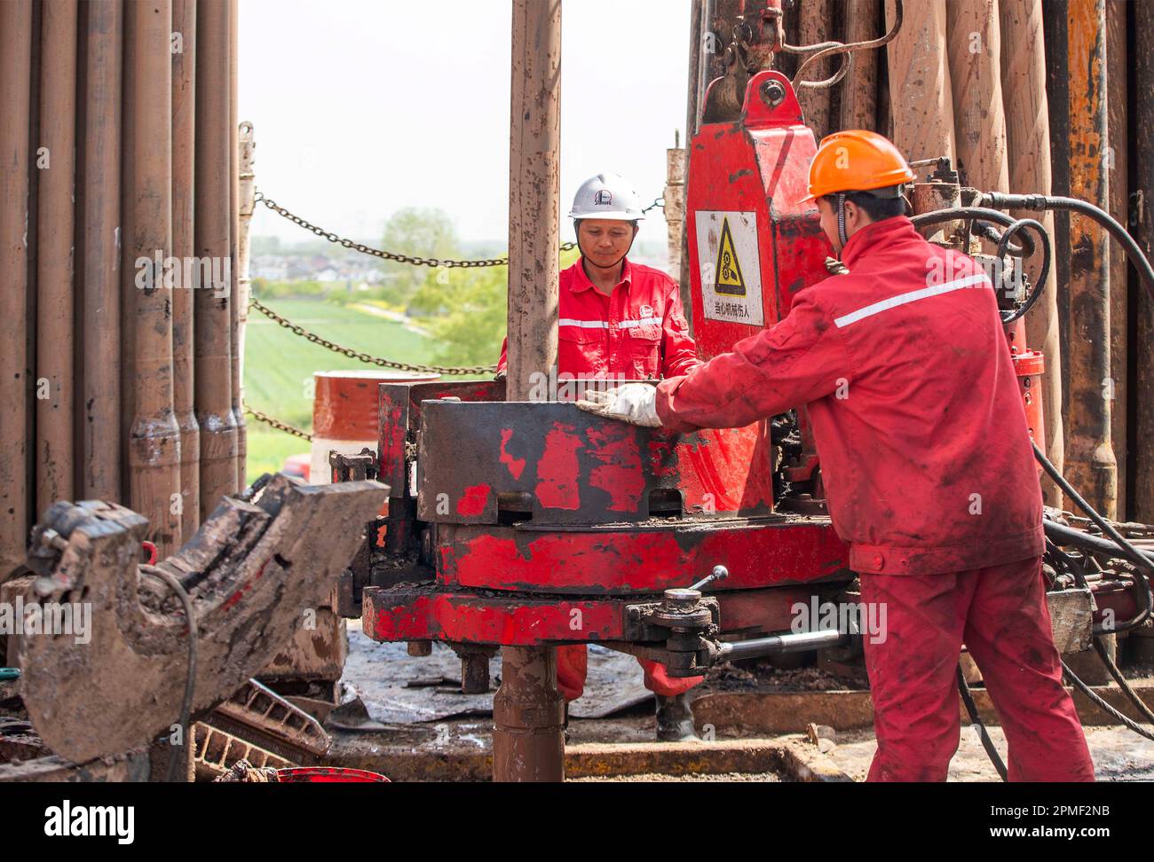 TAIZHOU, CHINA - APRIL 13, 2023 - Drillers work at a shale oil well ...