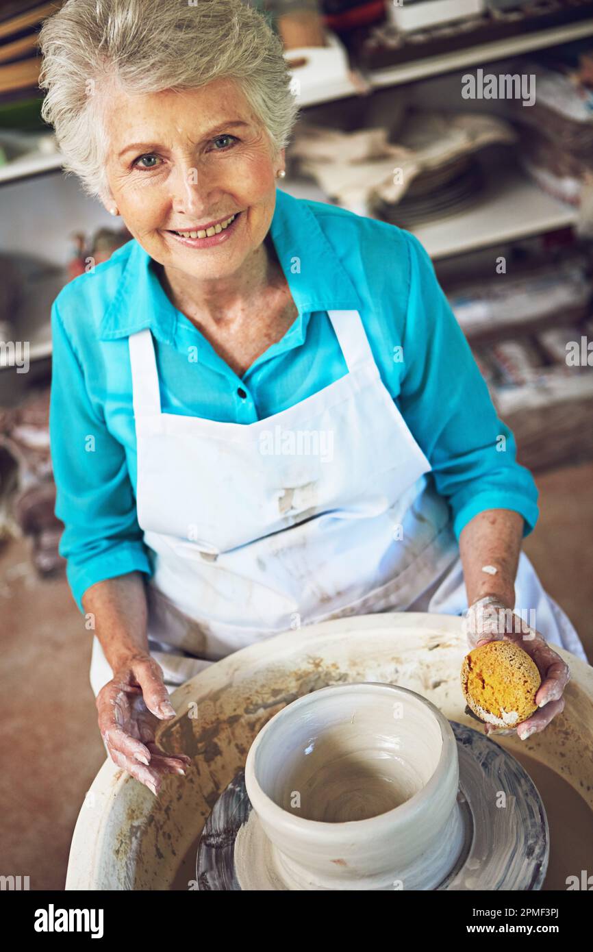 Working with my hands brings me so much happiness. Portrait of a senior ...