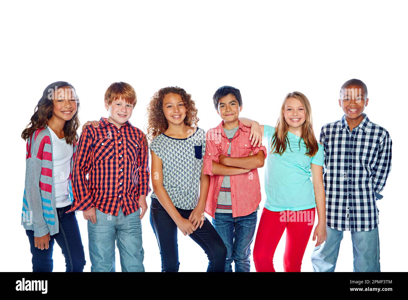 On the tween scene. Studio portrait of a group of young friends hanging out against a white ...