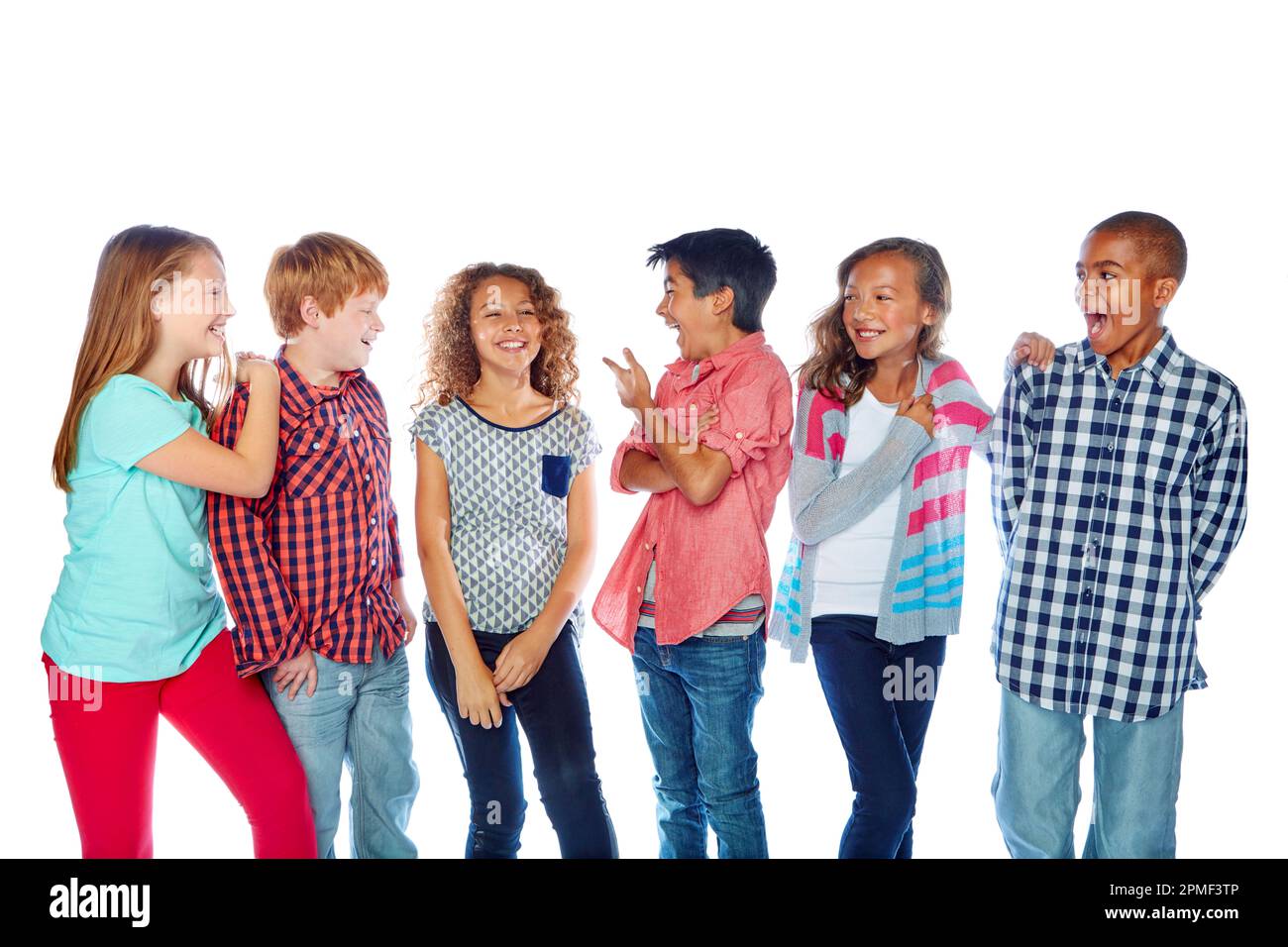 Lined up for fun. Studio shot of a group of young friends hanging out ...