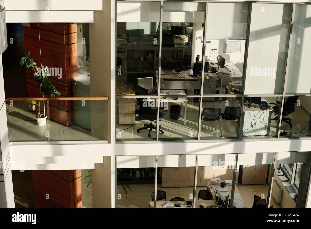 Horizontal image of modern business building with glass walls and ...