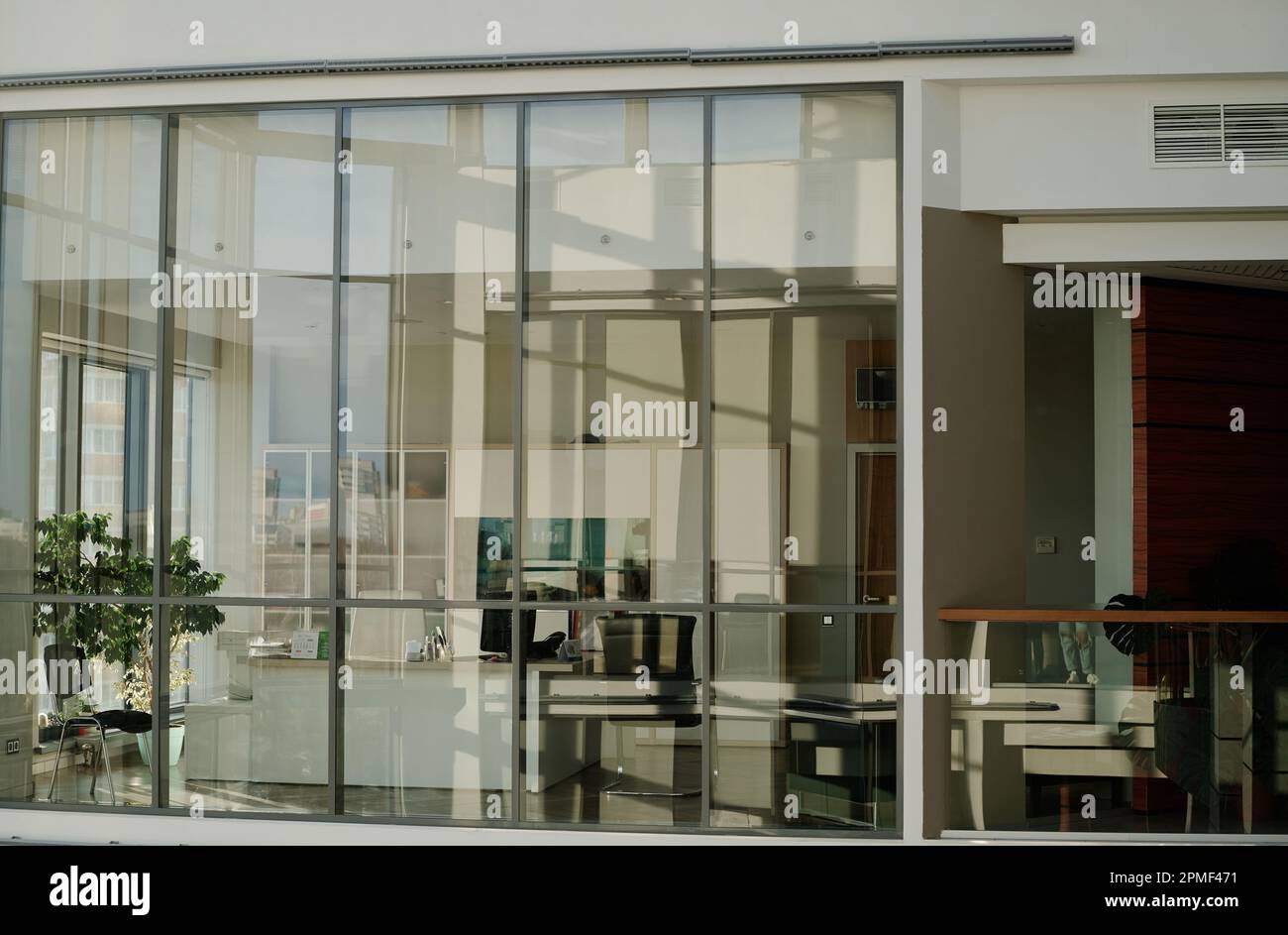 Horizontal image of modern office centre with glass walls and ...