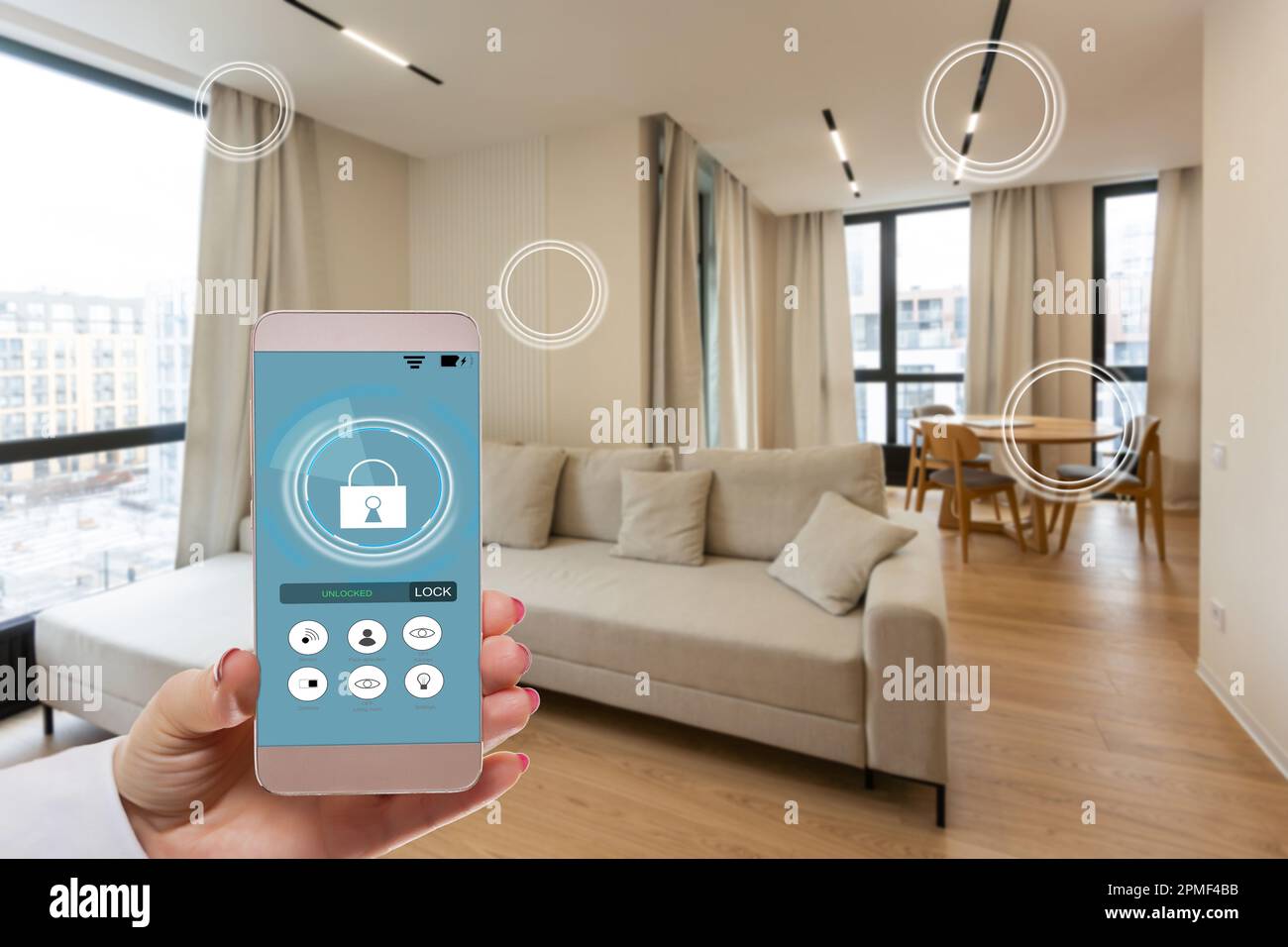 All the house in a phone. Close up of young woman user hands ...