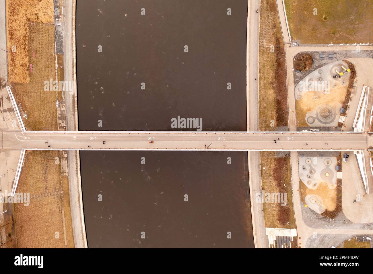 Drone photography of pedestrian footbridge and people walking over ...