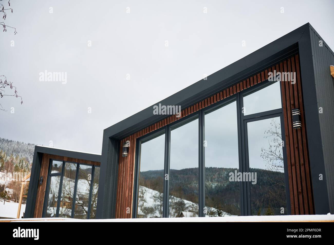 Two wooden small houses in Scandinavian modern style with large windows ...