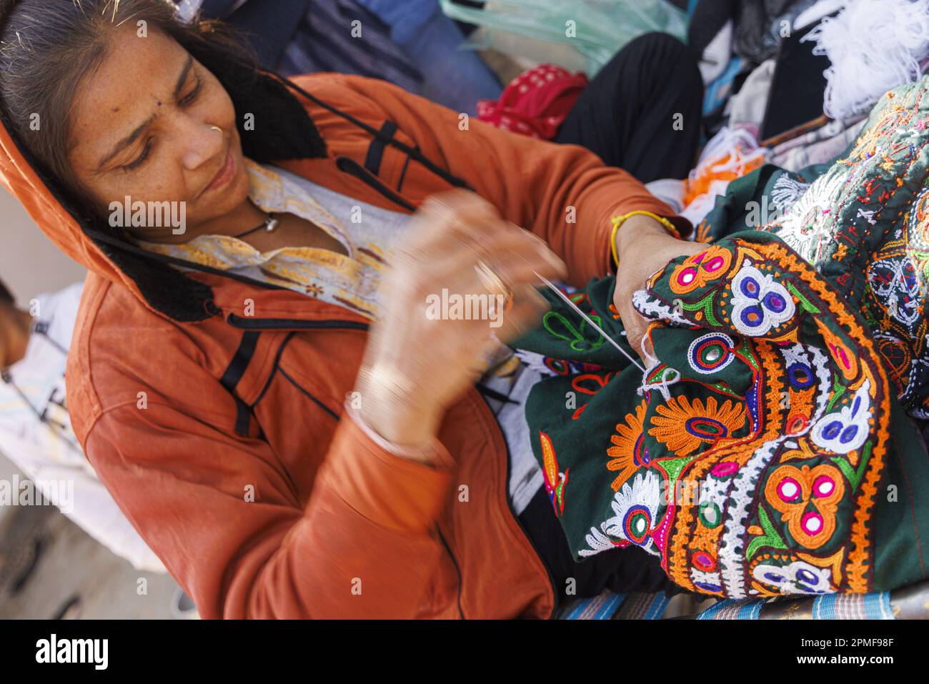 India, Gujarat, Padhar, young Ahir woman embroidering a fabric Stock ...