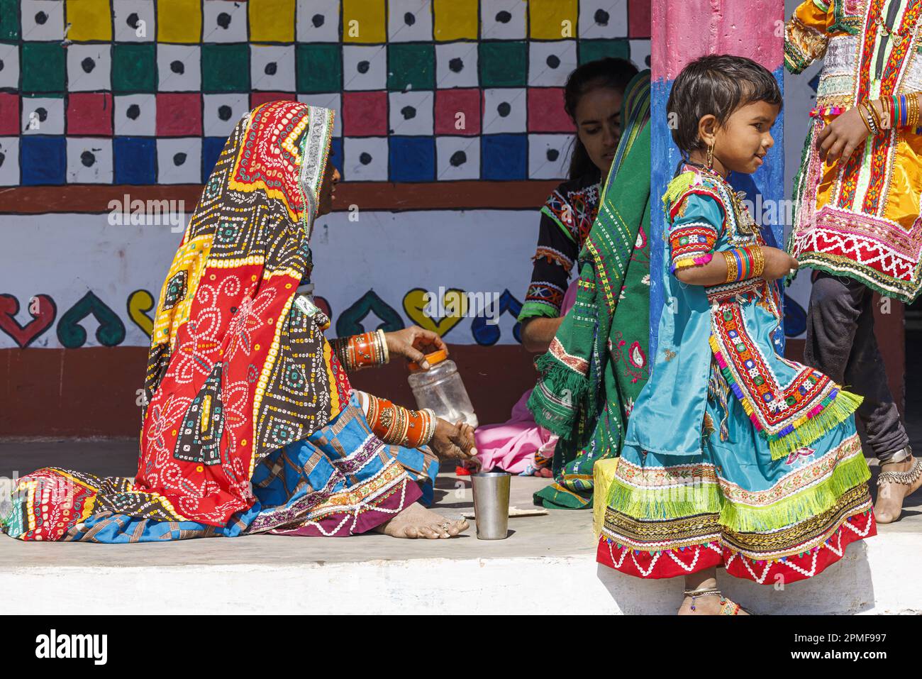 India, Gujarat, Ludiya, Meghwal or Harijan family before its house or ...