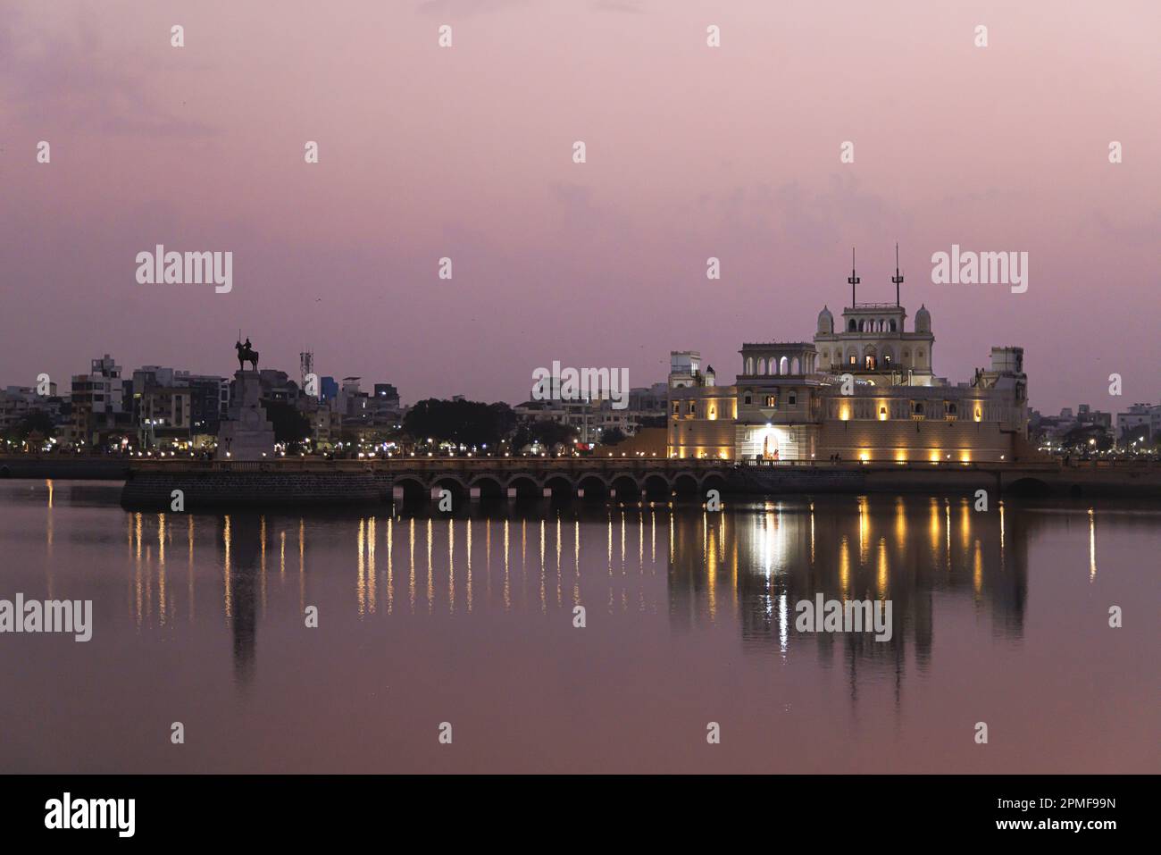 India, Gujarat, Jamnagar, Lakhota Palace and Lakhota Lake at dusk Stock ...