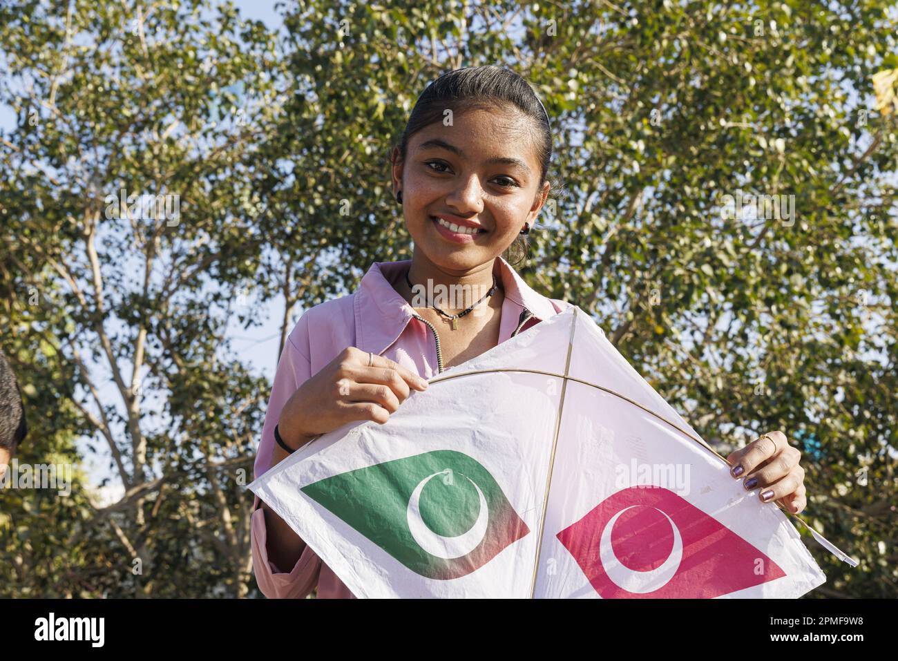 India, Gujarat, Ahmedabad, Uttarayan, kite festival, young indian girl ...