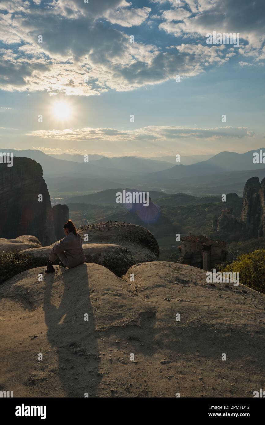 woman enjoying the sunset over Meteora in Spring Stock Photo - Alamy
