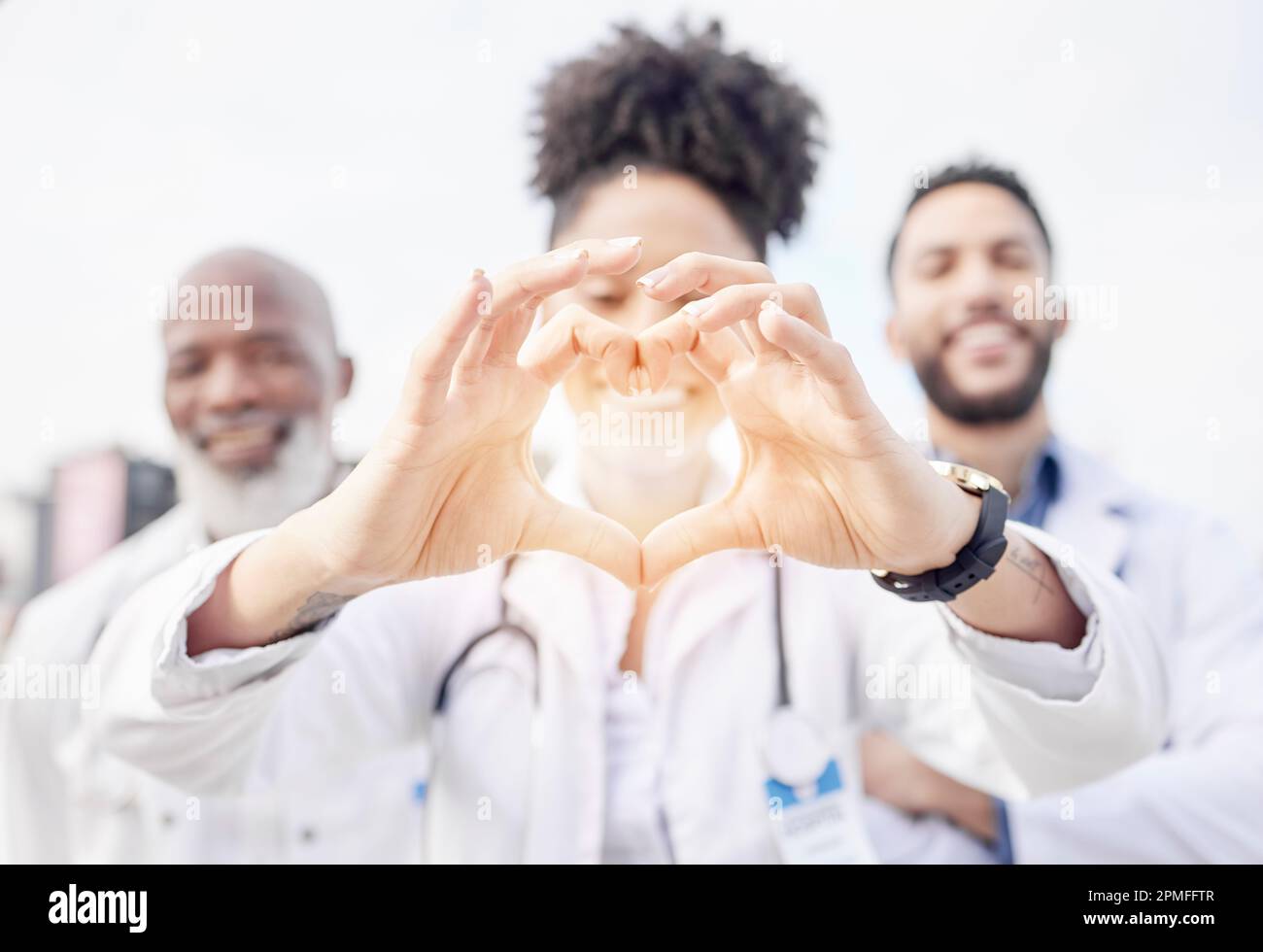Heart hand, happy and portrait of doctors in the city for healthcare ...